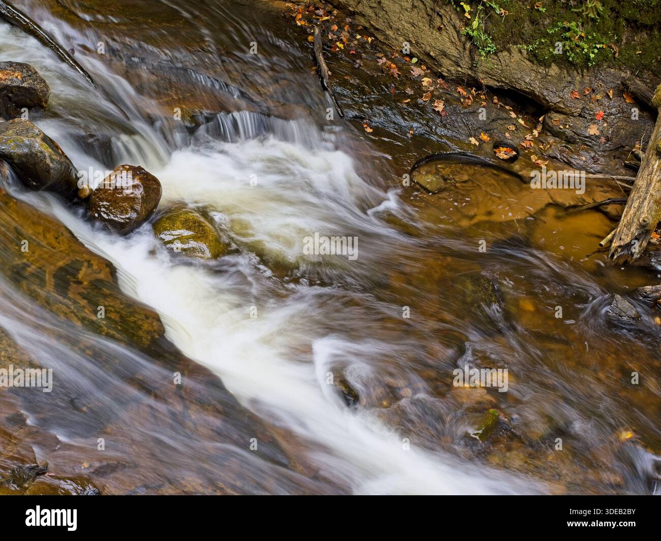 Flowing river water over rocky river bed of Sable Falls at Pictured ...