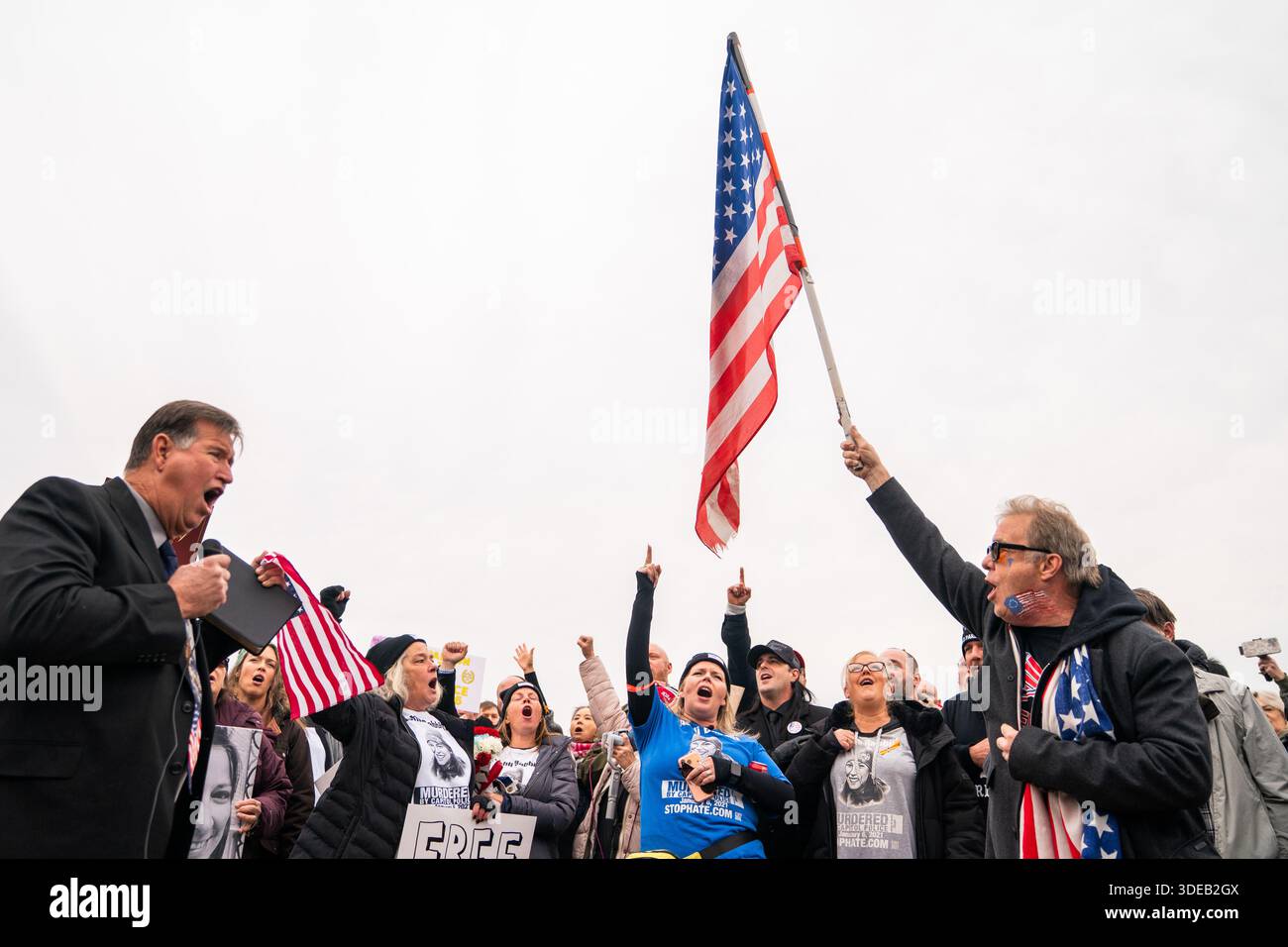 Supporters of Jan. 6 defendants rally before marching to the U.S ...