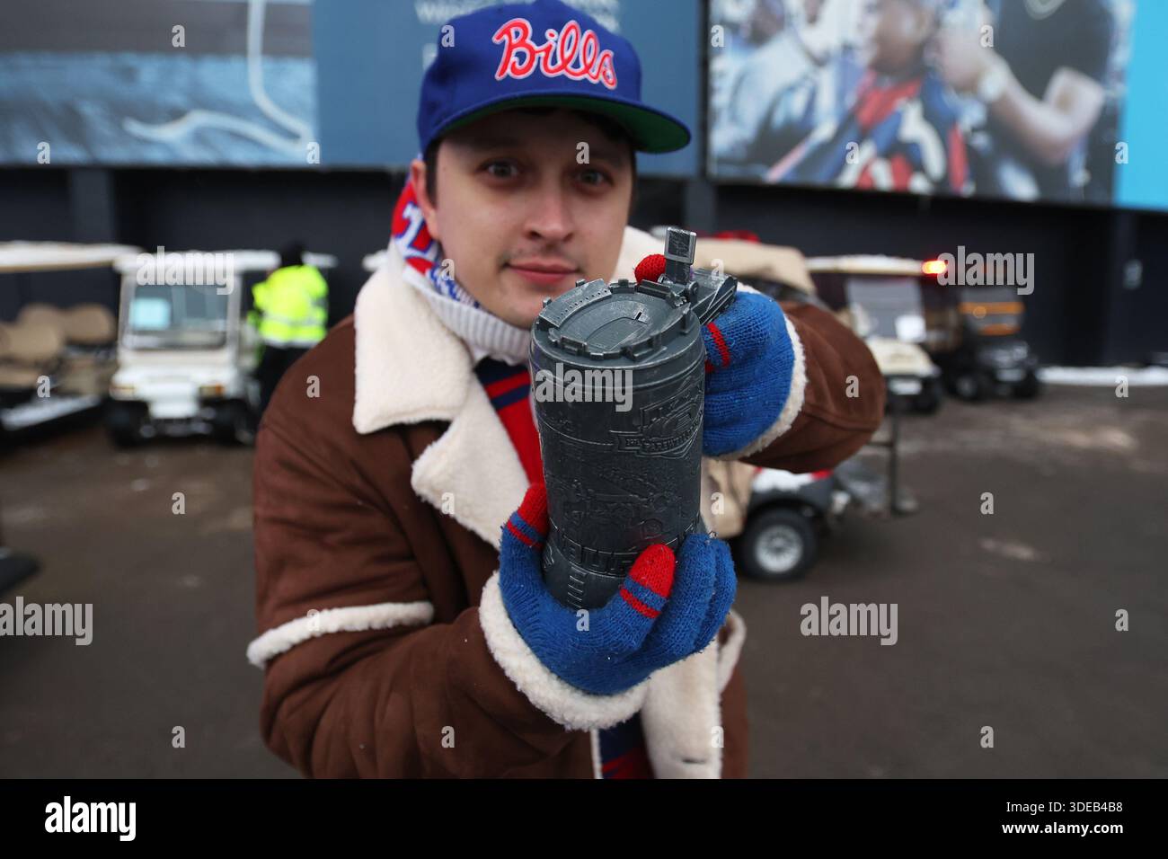 A Buffalo Bills fan poses with a souvenir cup prior to the first half ...