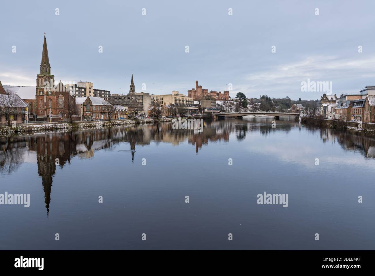 Snow covers Inverness City Centre as shadows form on the River Ness ...