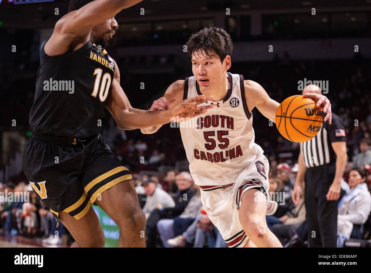 South Carolina guard Mike Sharavjamts (55) drives on Vanderbilt forward ...