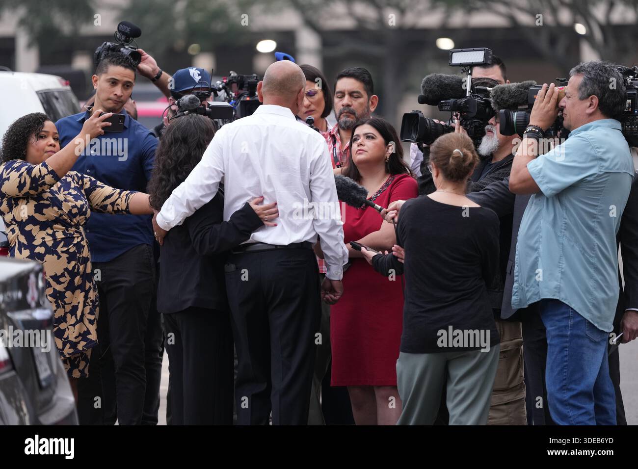 Family member Jesse Rizo, center, talks to the media before the trial ...
