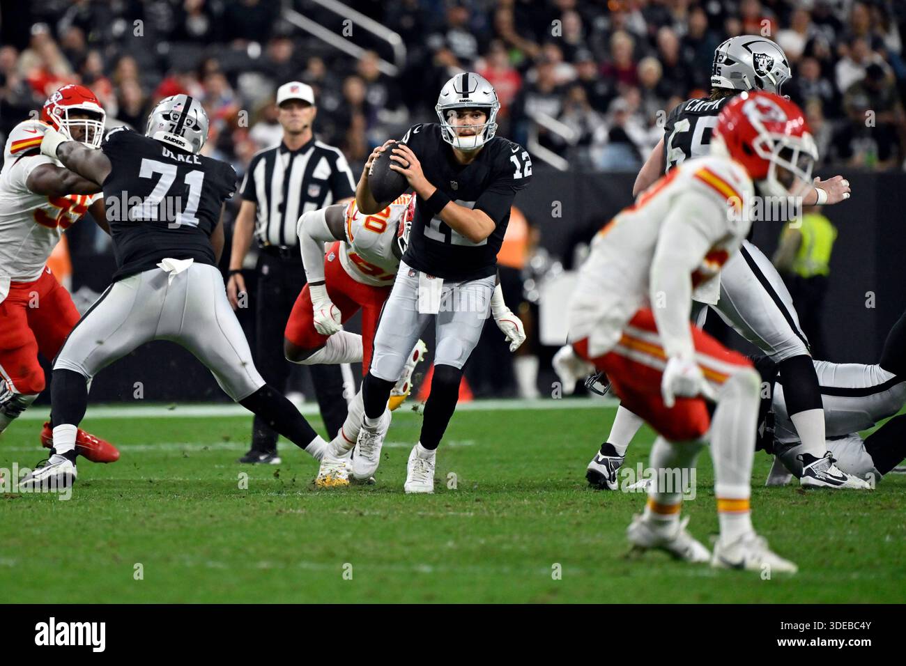 Las Vegas Raiders quarterback Aidan O'Connell (12) runs with the ball ...