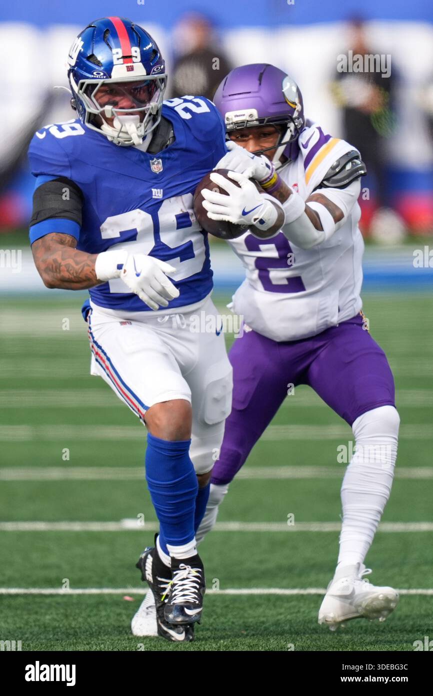 Minnesota Vikings cornerback Isaiah Rodgers (2), right, tries to tackle ...