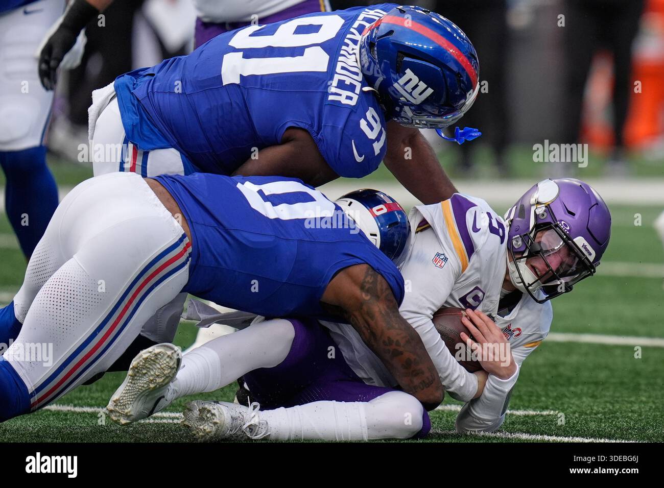 Minnesota Vikings quarterback J.J. McCarthy (9) is sacked by New York Giants defenders during an ...