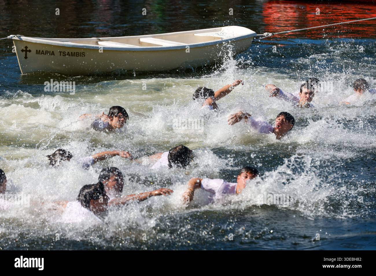 Cross divers swim quickly towards the cross during the annual cross ...
