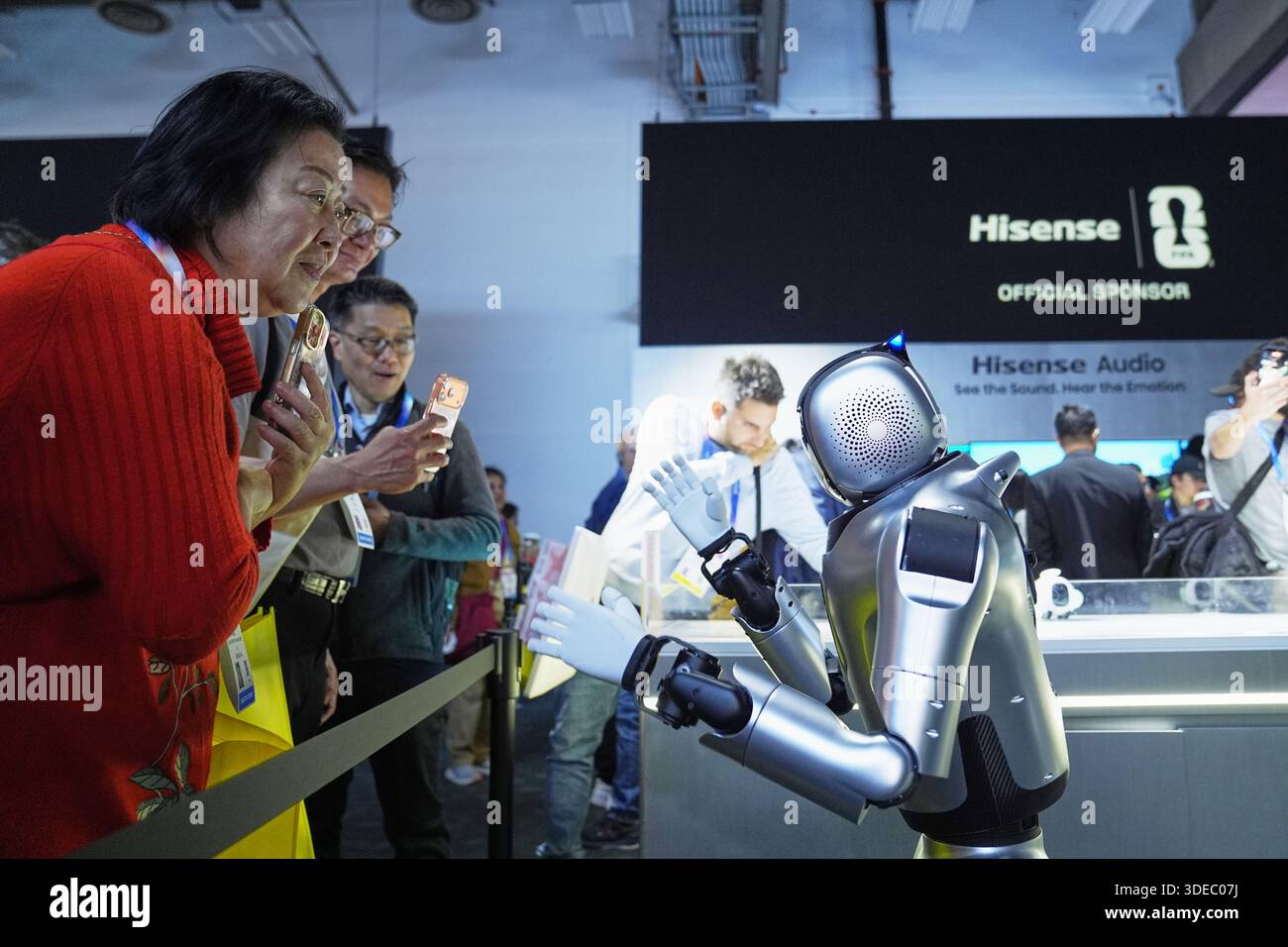 People look at a Hisense robot during the CES tech show Tuesday, Jan. 6 ...