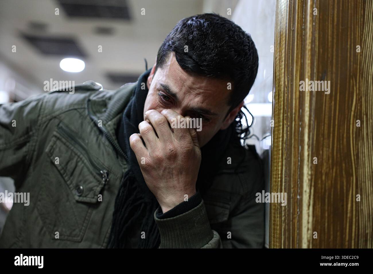 Syrian man Mohammed Ajam, weeps at a hospital after his son, Ghaith, 4 ...