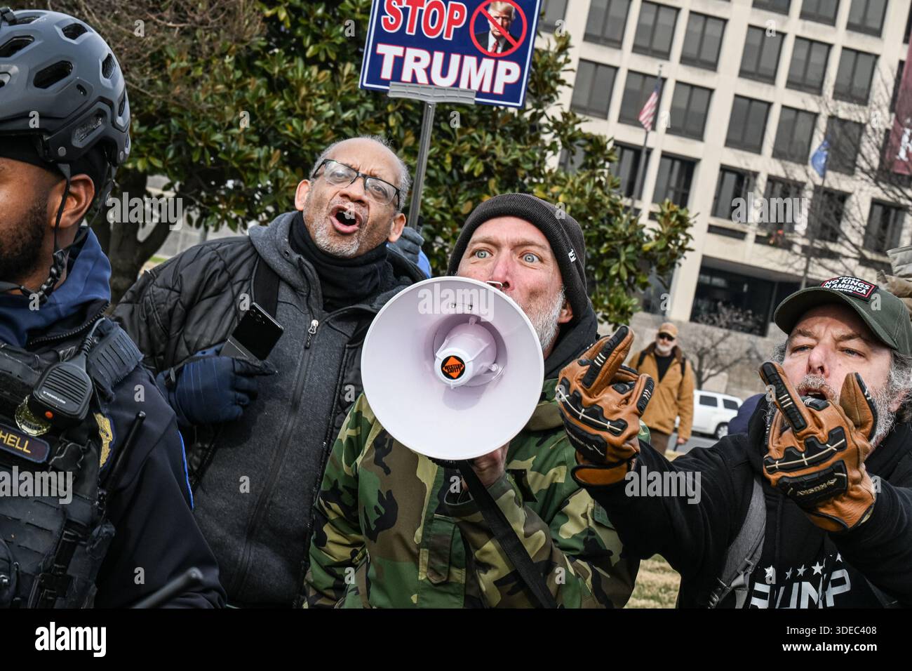 Counter-protesters shout at January 6 defendants and members of the ...