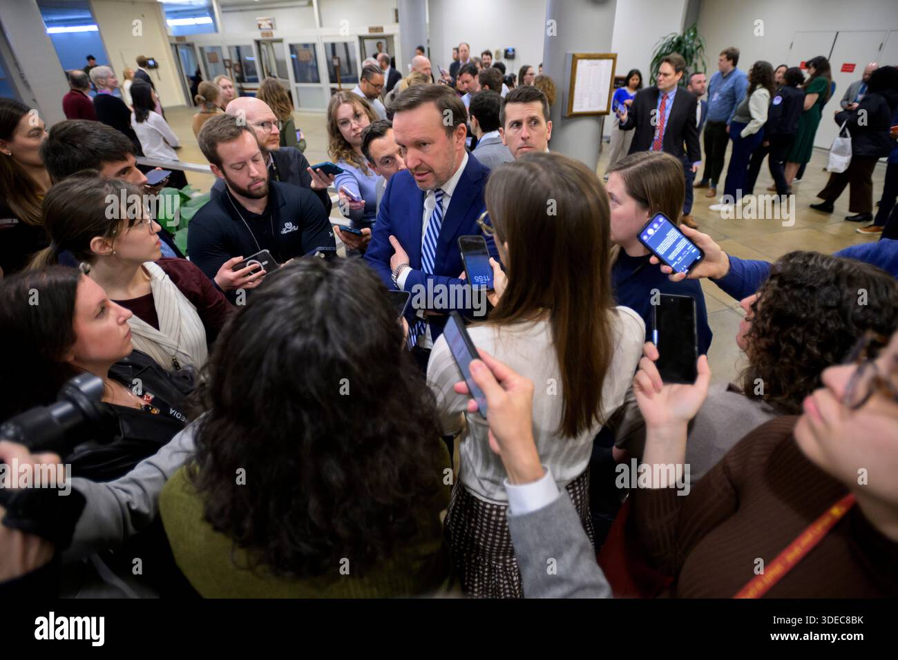 Sen. Christopher Murphy, D-Conn., center, talks with reporters in the ...