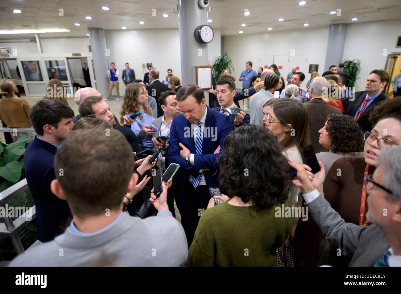 Sen. Christopher Murphy, D-Conn., center, talks with reporters in the ...