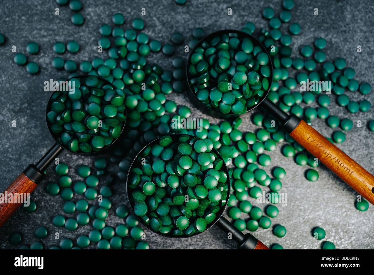 Measuring spoons spirulina tablets super hi-res stock photography and ...