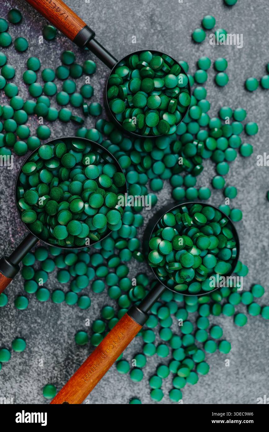 Measuring spoons spirulina tablets super hi-res stock photography and ...