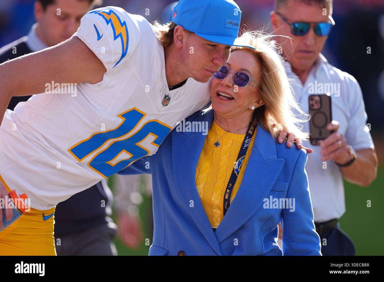 Los Angeles Chargers punter J.K. Scott (16) greets a member of the ...