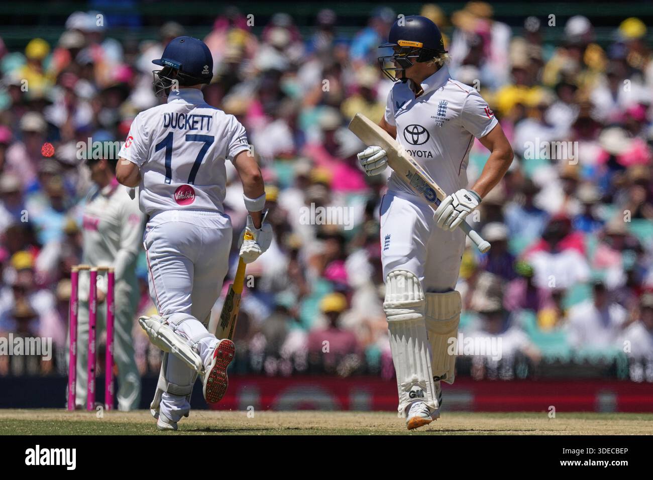 England's Jacob Bethell, right, and teammate Ben Duckett run between ...