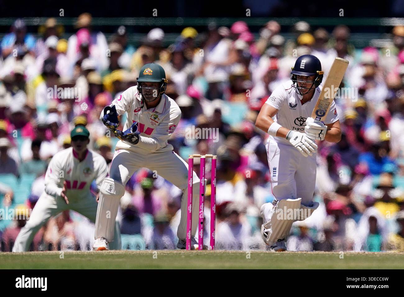 England’s Jacob Bethell (right) bats while Australia's Alex Carey (left ...