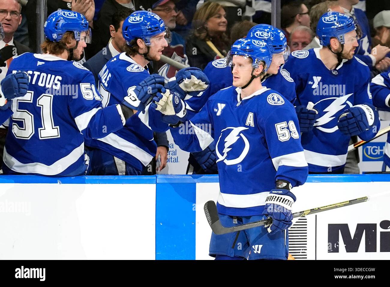 Tampa Bay Lightning center Jake Guentzel (59) celebrates with the bench ...