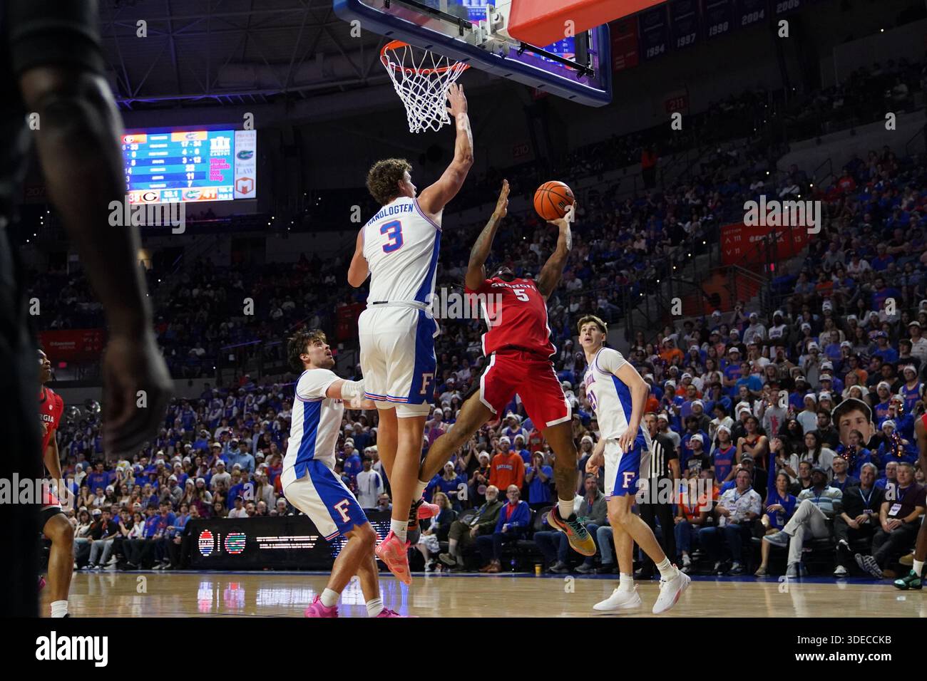 Georgia guard Jeremiah Wilkinson attempts to shoot as Florida center ...