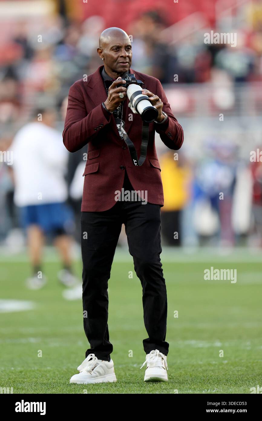 Former San Francisco 49ers player Jerry Rice walks on the field during ...