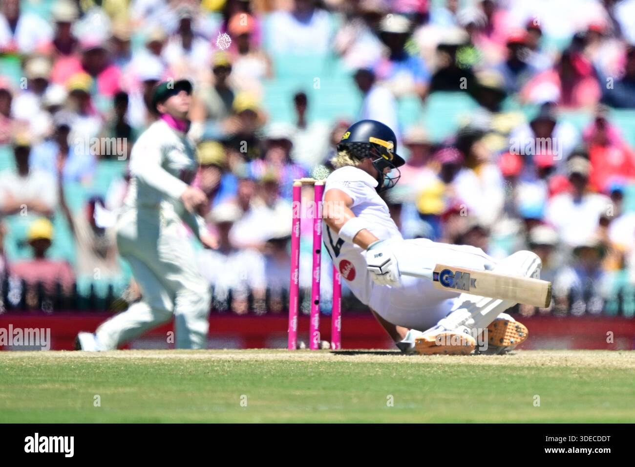 Jacob Bethell of England is hit by a bouncer from Cameron Green of ...