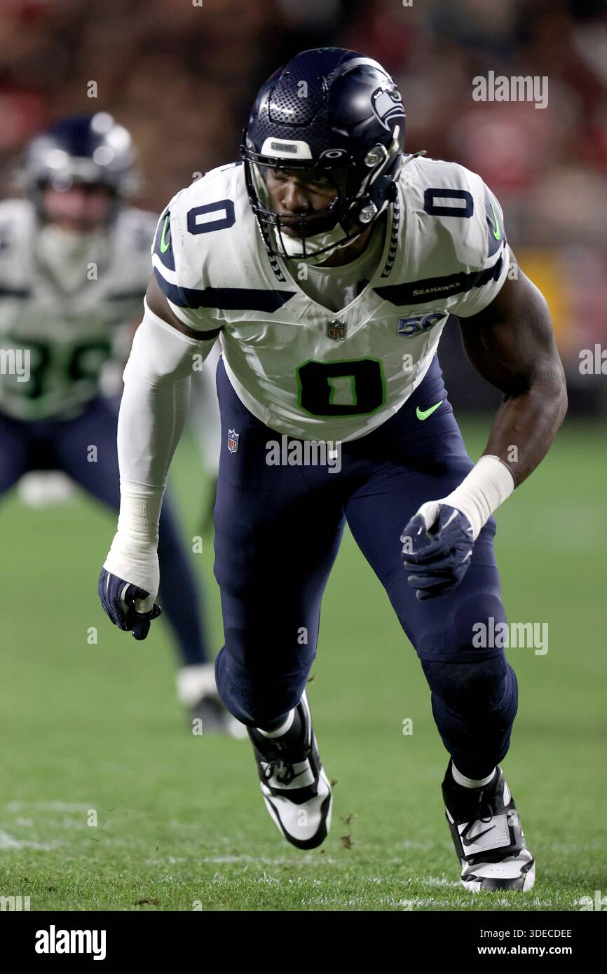 Seattle Seahawks linebacker DeMarcus Lawrence (0) rushes during an NFL ...