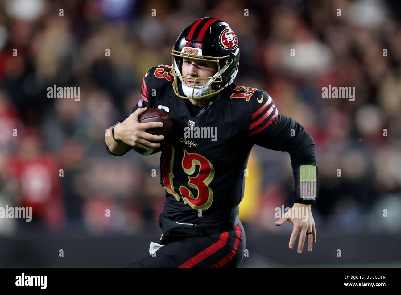 San Francisco 49ers quarterback Brock Purdy (13) runs during an NFL ...