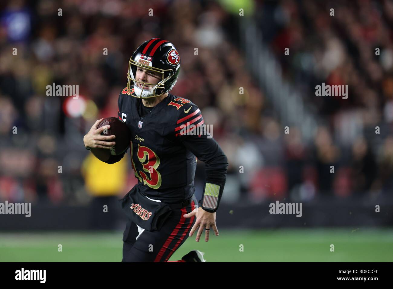 San Francisco 49ers quarterback Brock Purdy (13) runs during an NFL ...