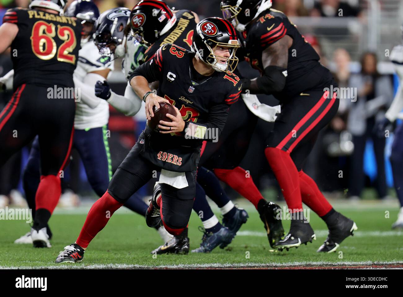 San Francisco 49ers quarterback Brock Purdy (13) runs during an NFL ...