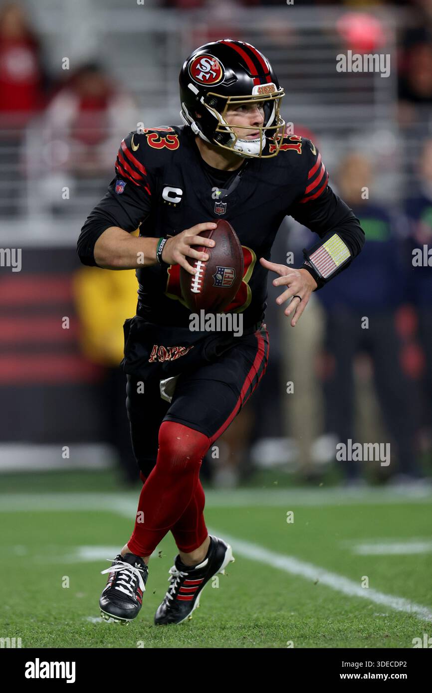 San Francisco 49ers quarterback Brock Purdy (13) runs during an NFL ...