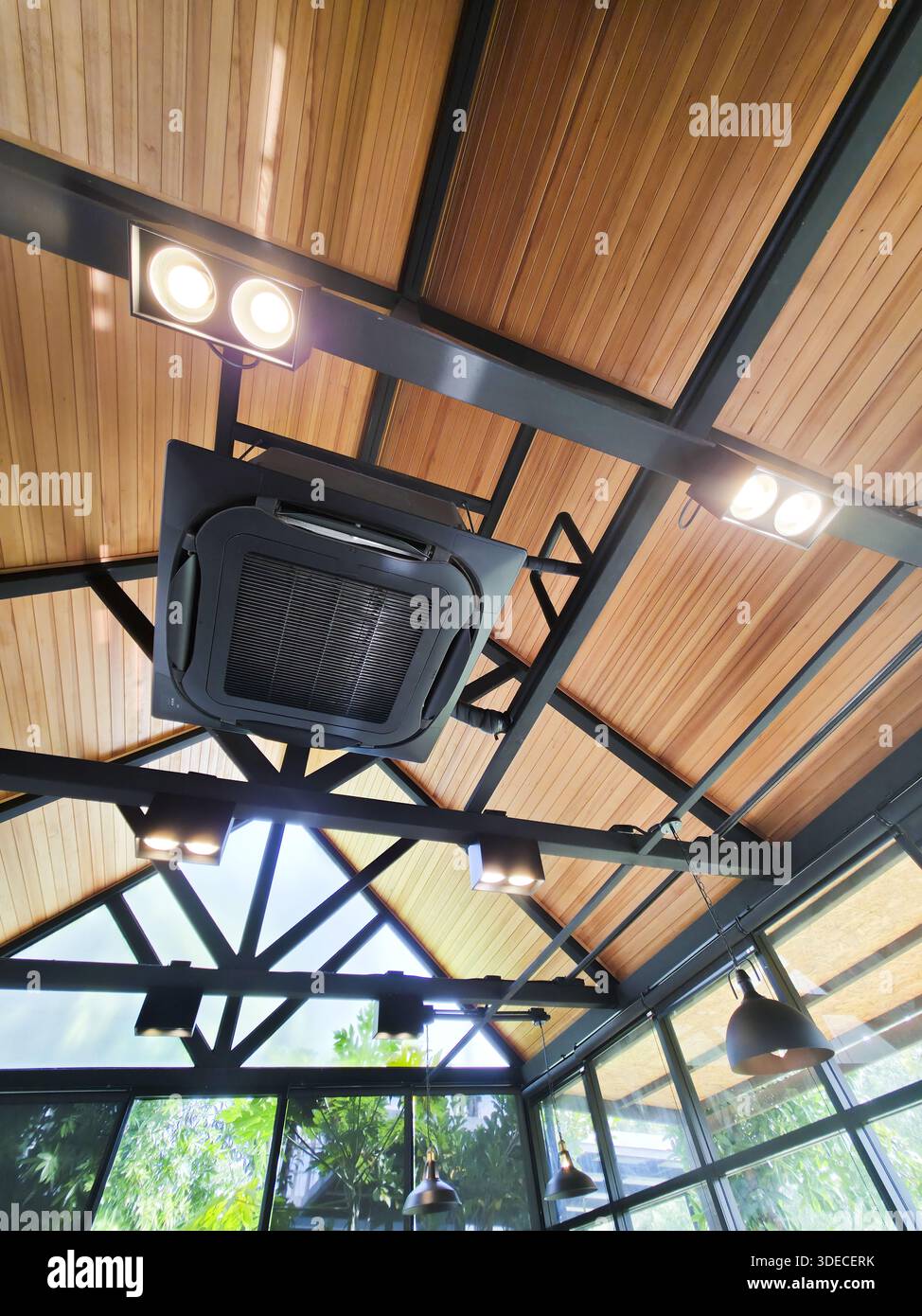 Detailed perspective looking up modern industrial ceiling with wood ...
