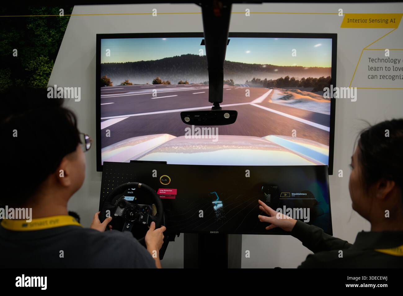 People take part in a simulator for Smart Eye interior sensing AI ...
