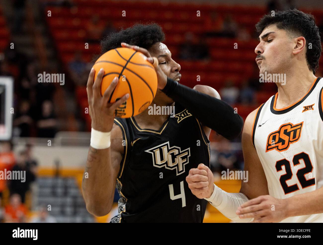 Central Florida forward Jamichael Stillwell (4) fouls Oklahoma State ...
