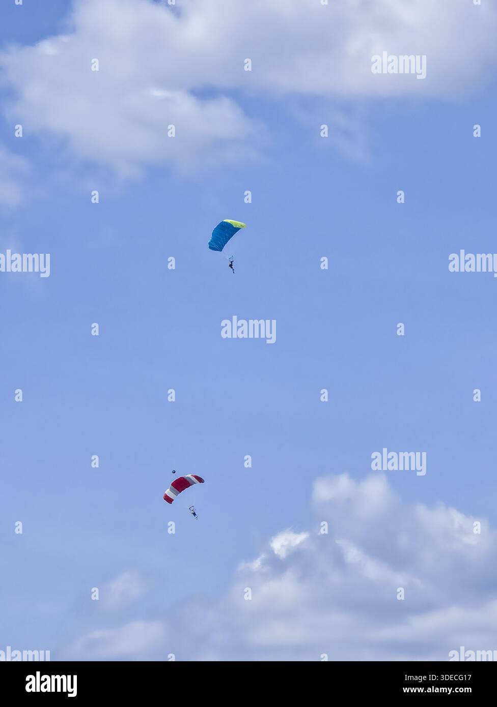 Thrilling outdoor skydiving adventure featuring two skydivers floating ...