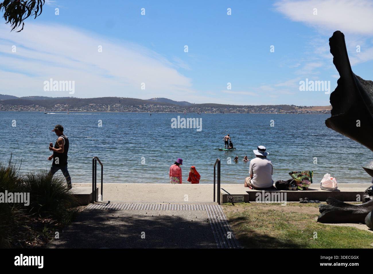 Beachgoers escape the heat at Long Beach at Sandy Bay in Hobart ...