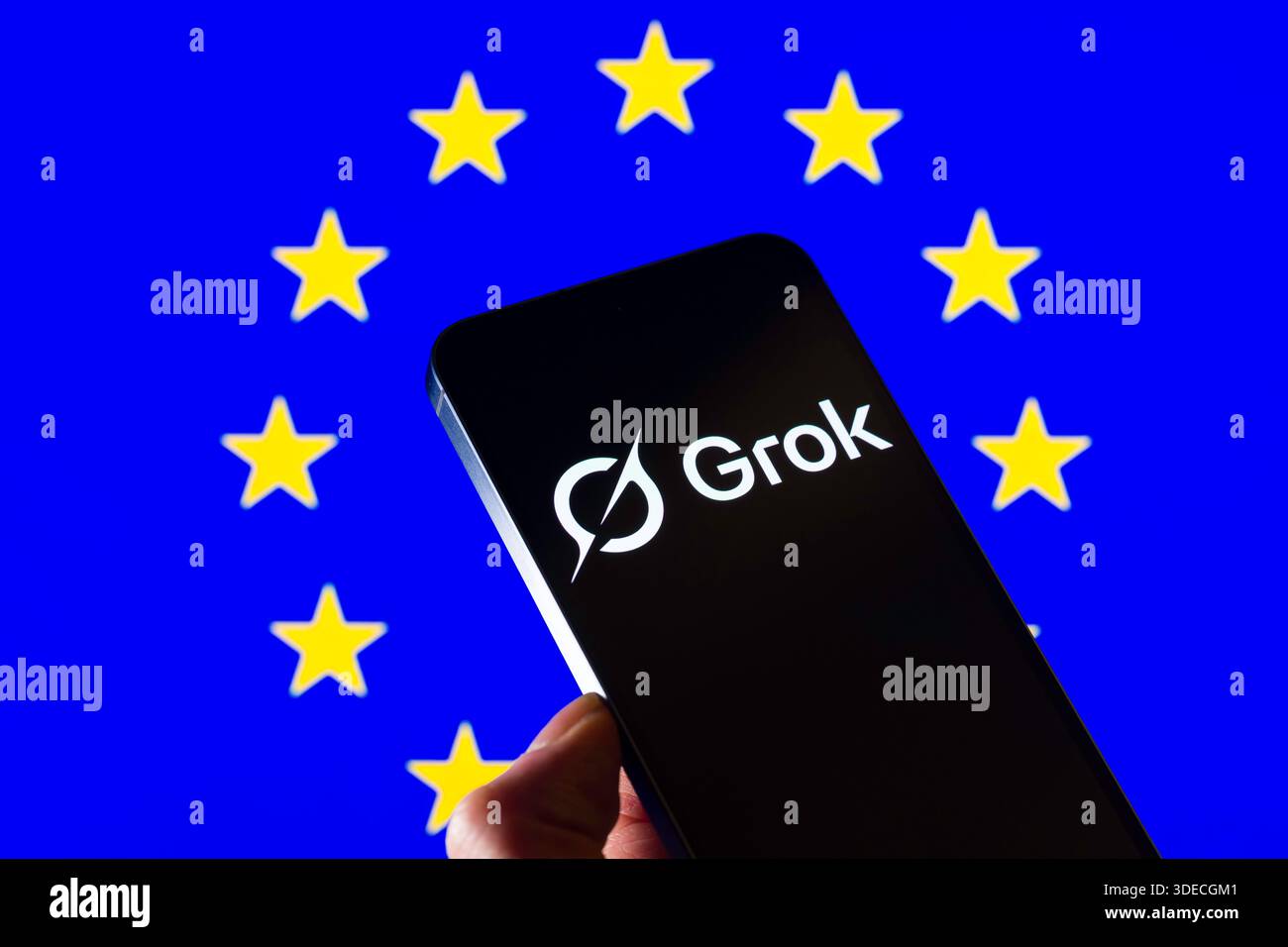 The Grok logo is displayed on a mobile phone with the EU flag visible ...