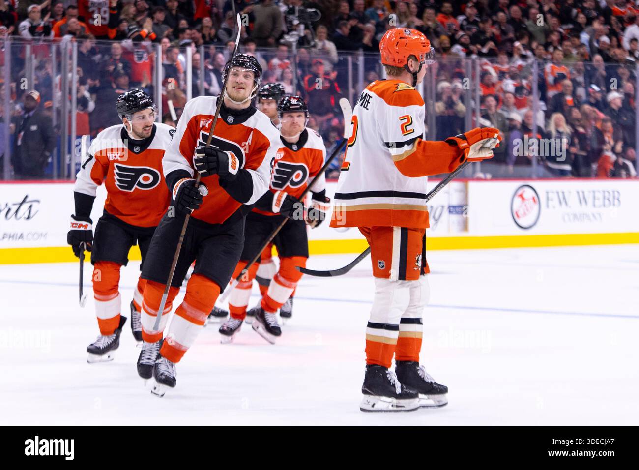 Philadelphia Flyers' Travis Sanheim, second from left, celebrates his ...