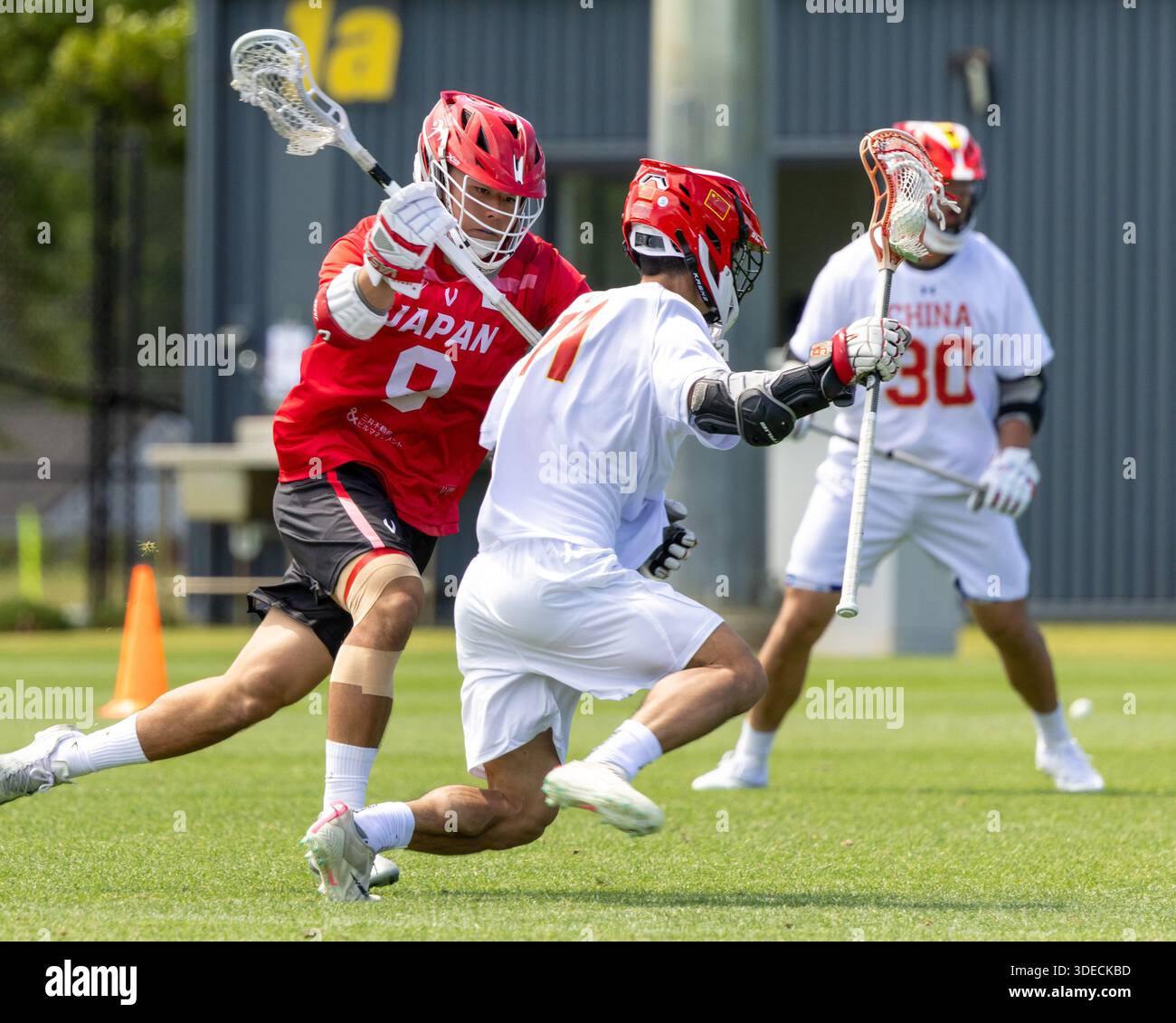 Haonan Chen (11, China) keeps his balance despite close pressure from ...