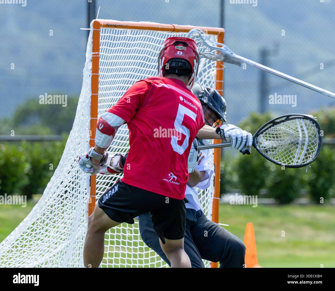 Goalkeeper Bangding Wang (1, China) brave in his effort to stop a shot ...
