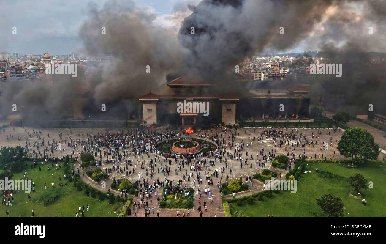 FILE - Protesters celebrate at the parliament building after it was set ...