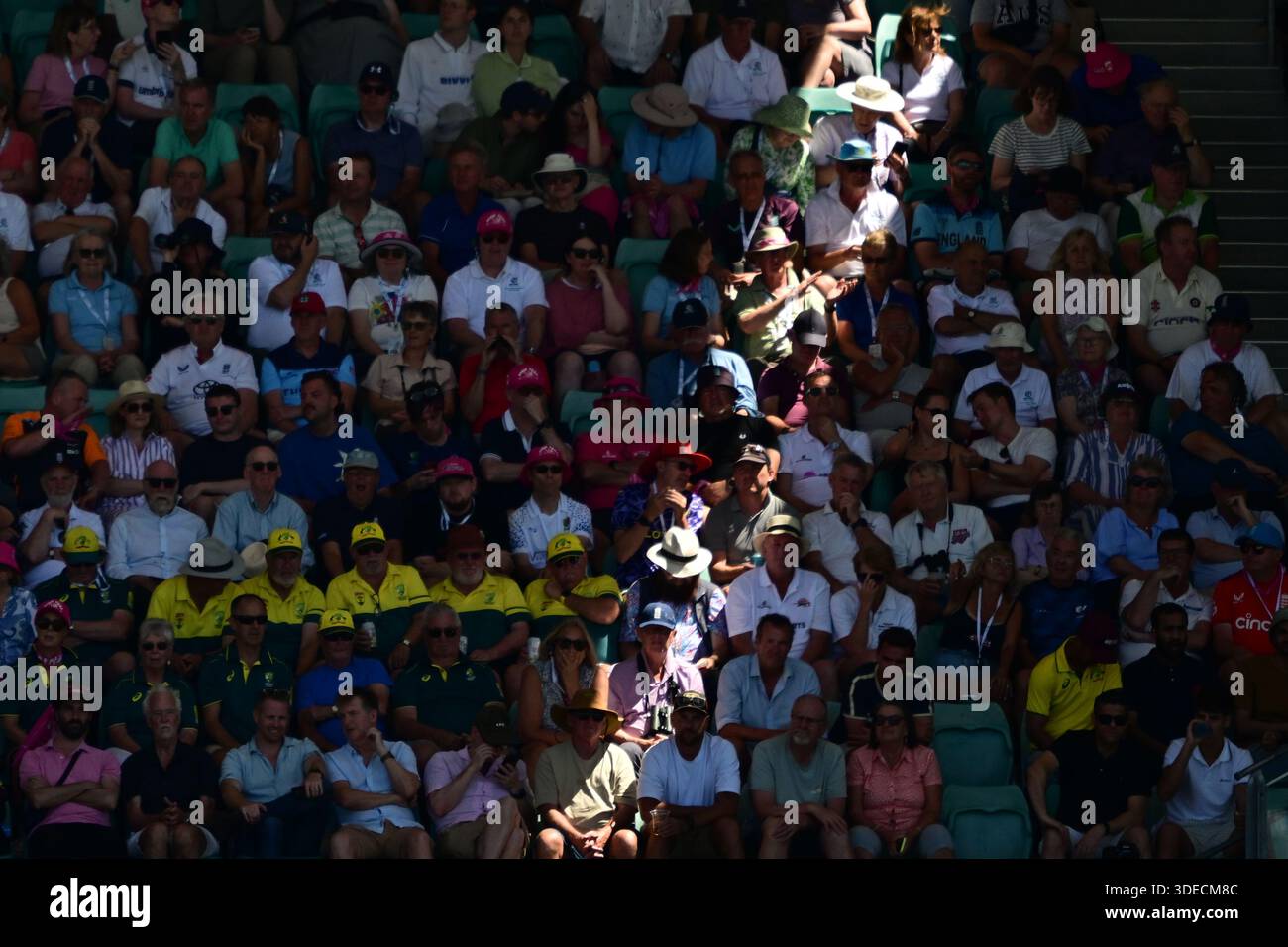 A slither of light on spectators in the Victor Trumper Stand during Day ...