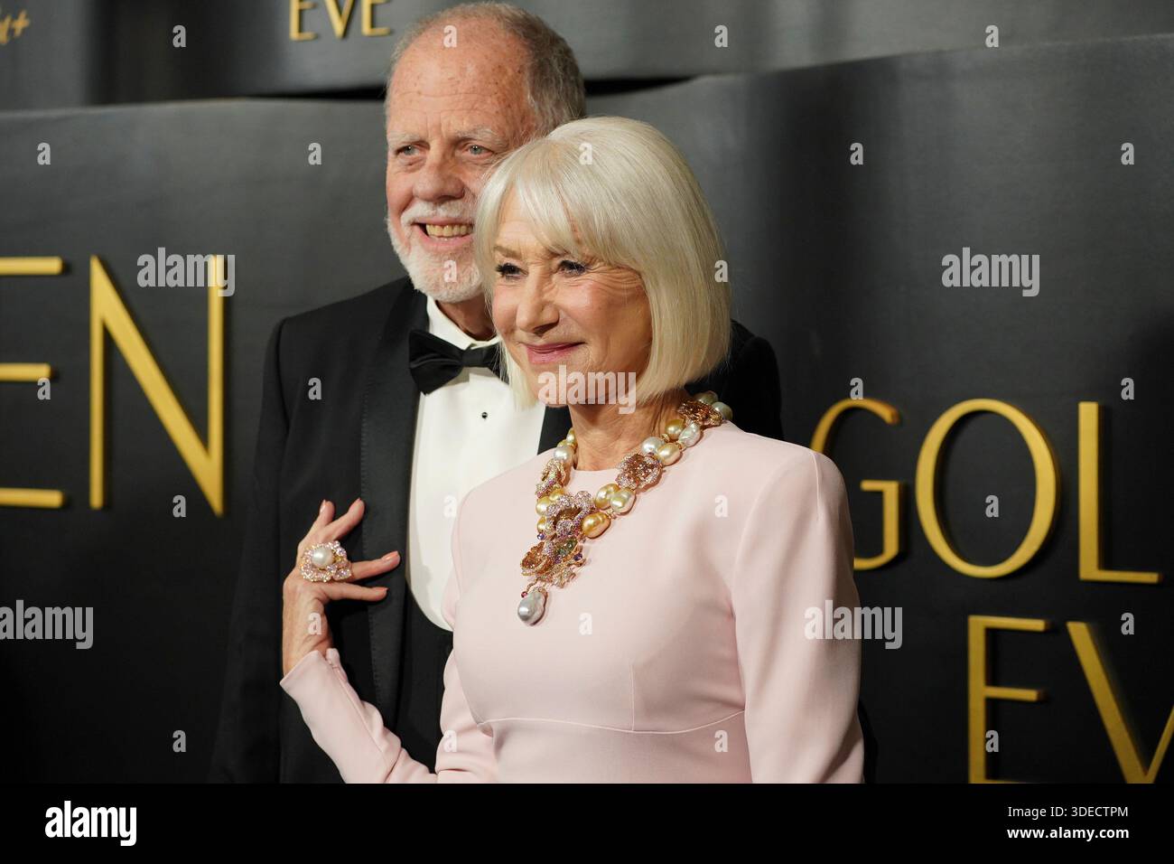 Taylor Hackford, left, and Helen Mirren arrive at the Golden Globes ...