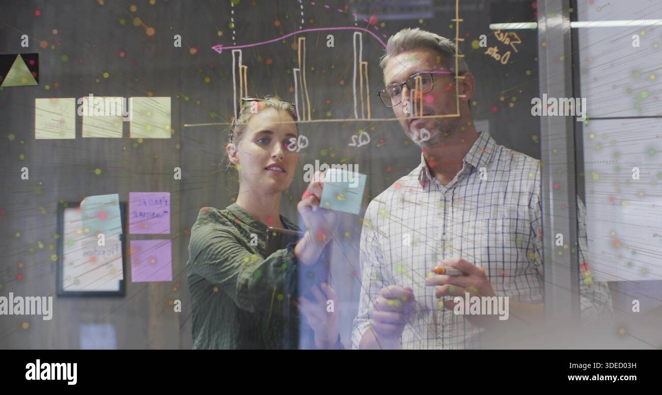 Placing woman in green blouse and man adding sticky notes on office ...