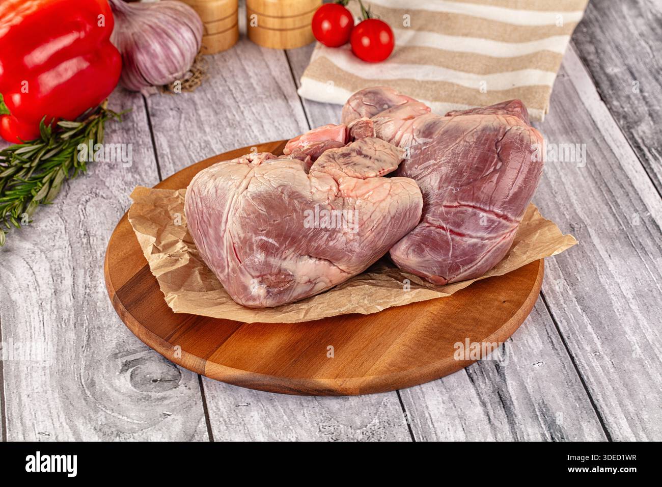 Uncooked raw fresh pork heart over board Stock Photo - Alamy