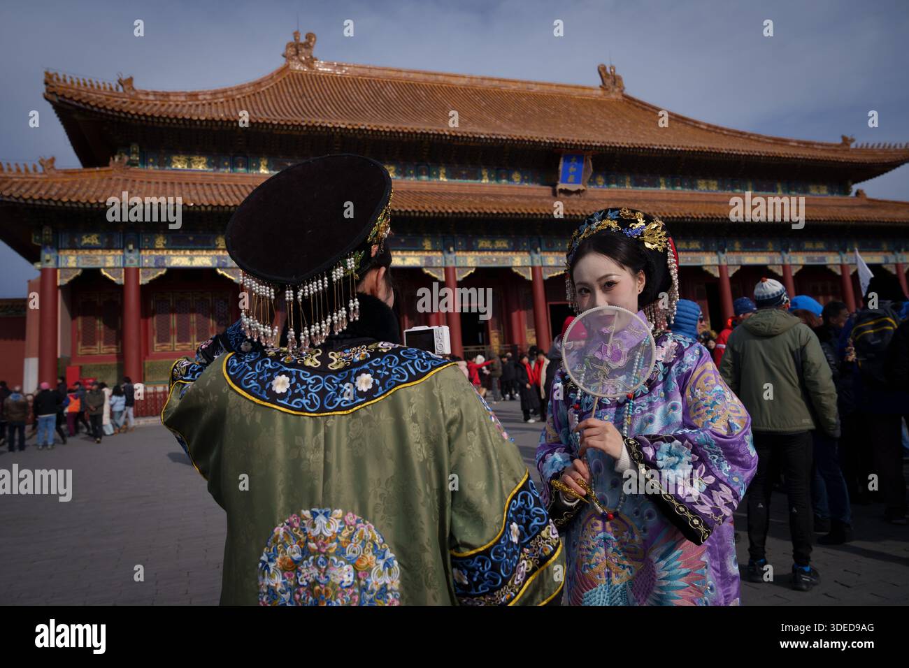 Chinese girls dressed in Qing Dynasty attire at the Forbidden City in ...
