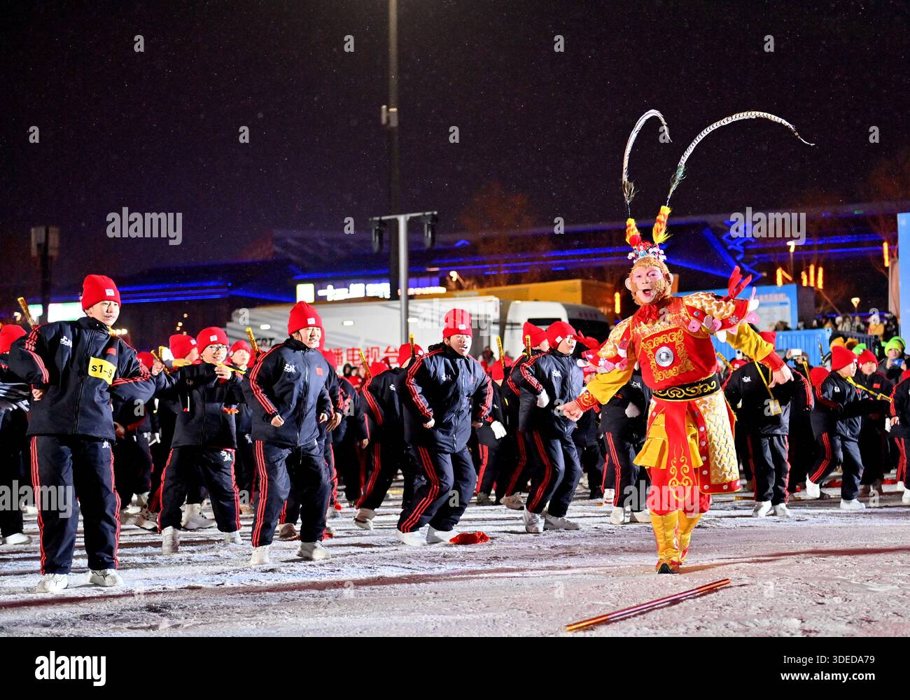 An actor dressed up as "Sun Wukong" shows the street dance with ...
