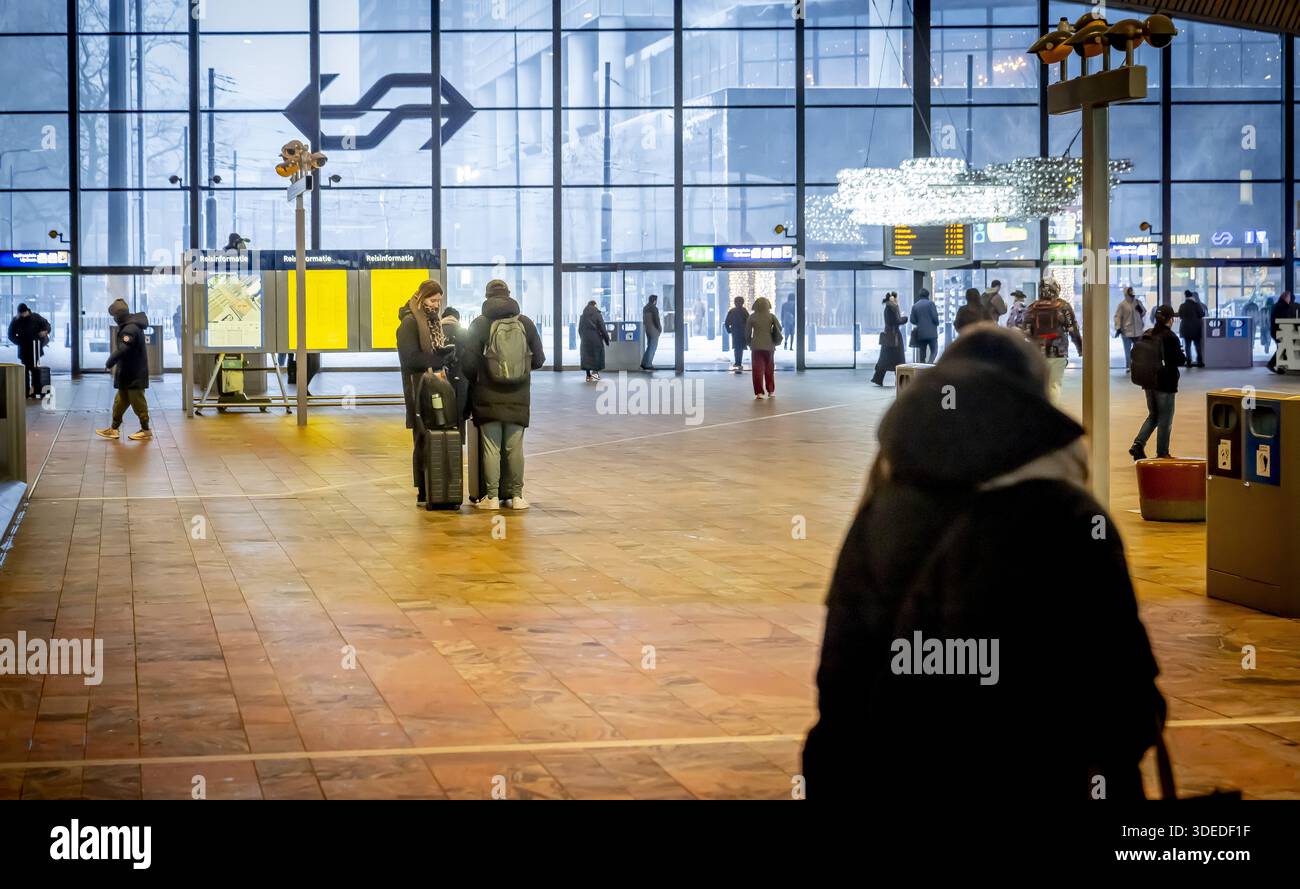 ROTTERDAM - Passengers at Rotterdam Central Station. Due to multiple ...