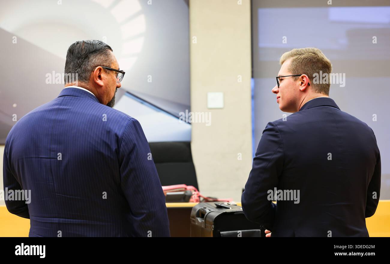 07 January 2026, Bavaria, Würzburg: AfD MP Daniel Halemba (r) stands ...