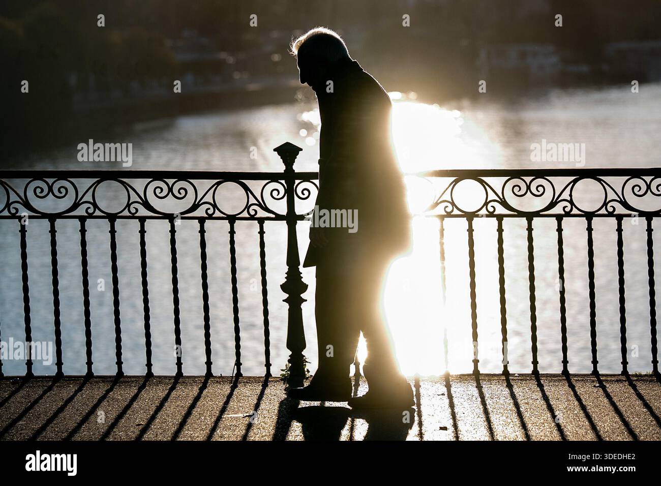 Passersby cross the Triana Bridge during the cold snap on January 07 ...