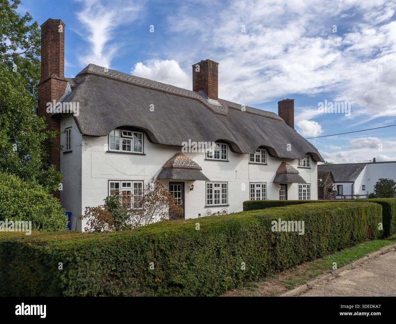 White painted brick cottages with thatched roofs c1939, later to become ...