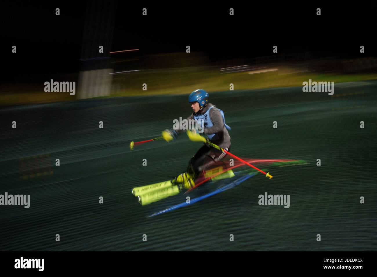 A racer brushes past a slalom gate during an inter-club ski meeting at ...